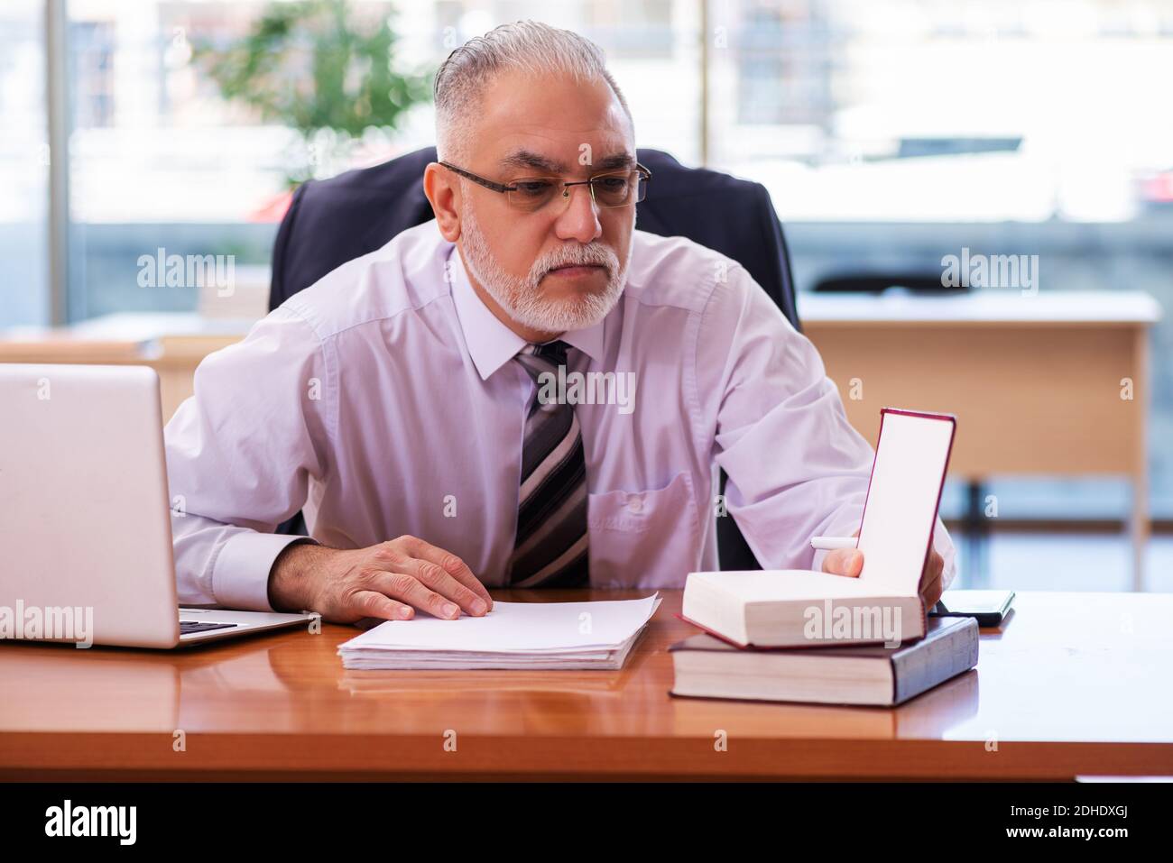 Old businessman employee working in the office Stock Photo - Alamy