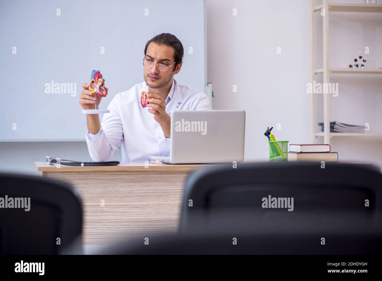Young male doctor cardiologist giving seminar in the classroom Stock ...