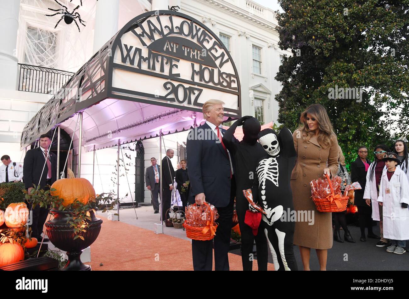 U.S. President Donald Trump and first lady Melania Trump hand out ...