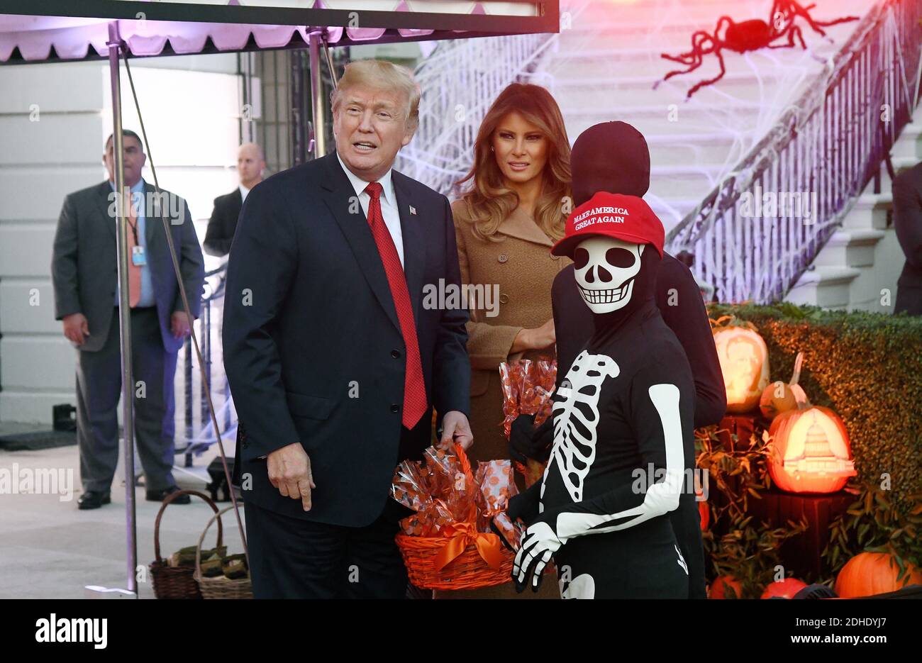 U.S. President Donald Trump and first lady Melania Trump hand out ...