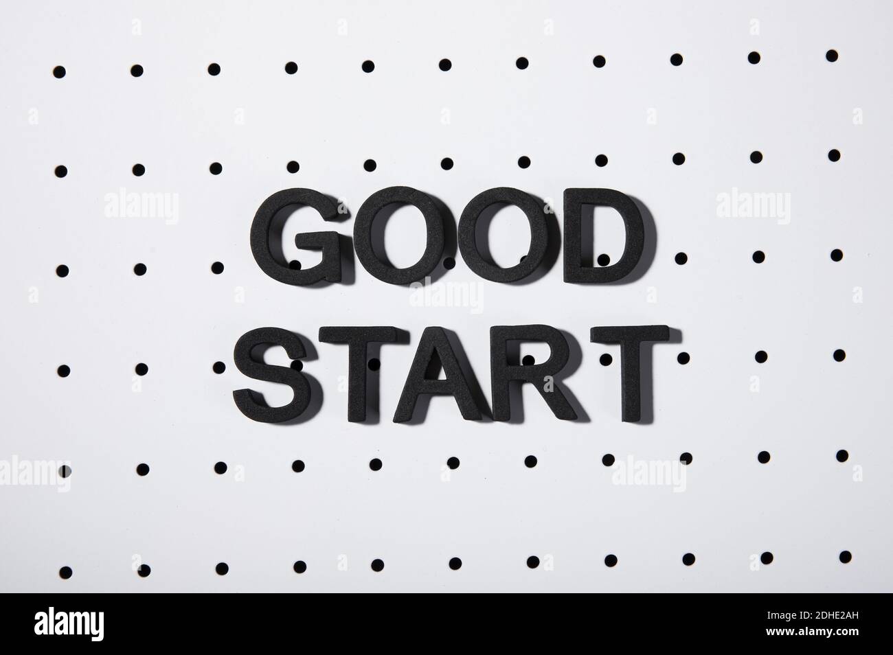 Black "GOOD START" text on white spotty background Stock Photo - Alamy