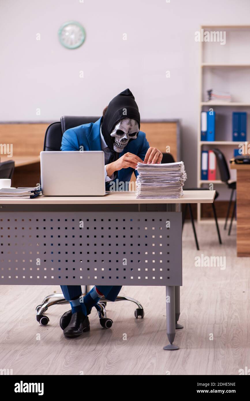 Devil businessman working in the office Stock Photo - Alamy