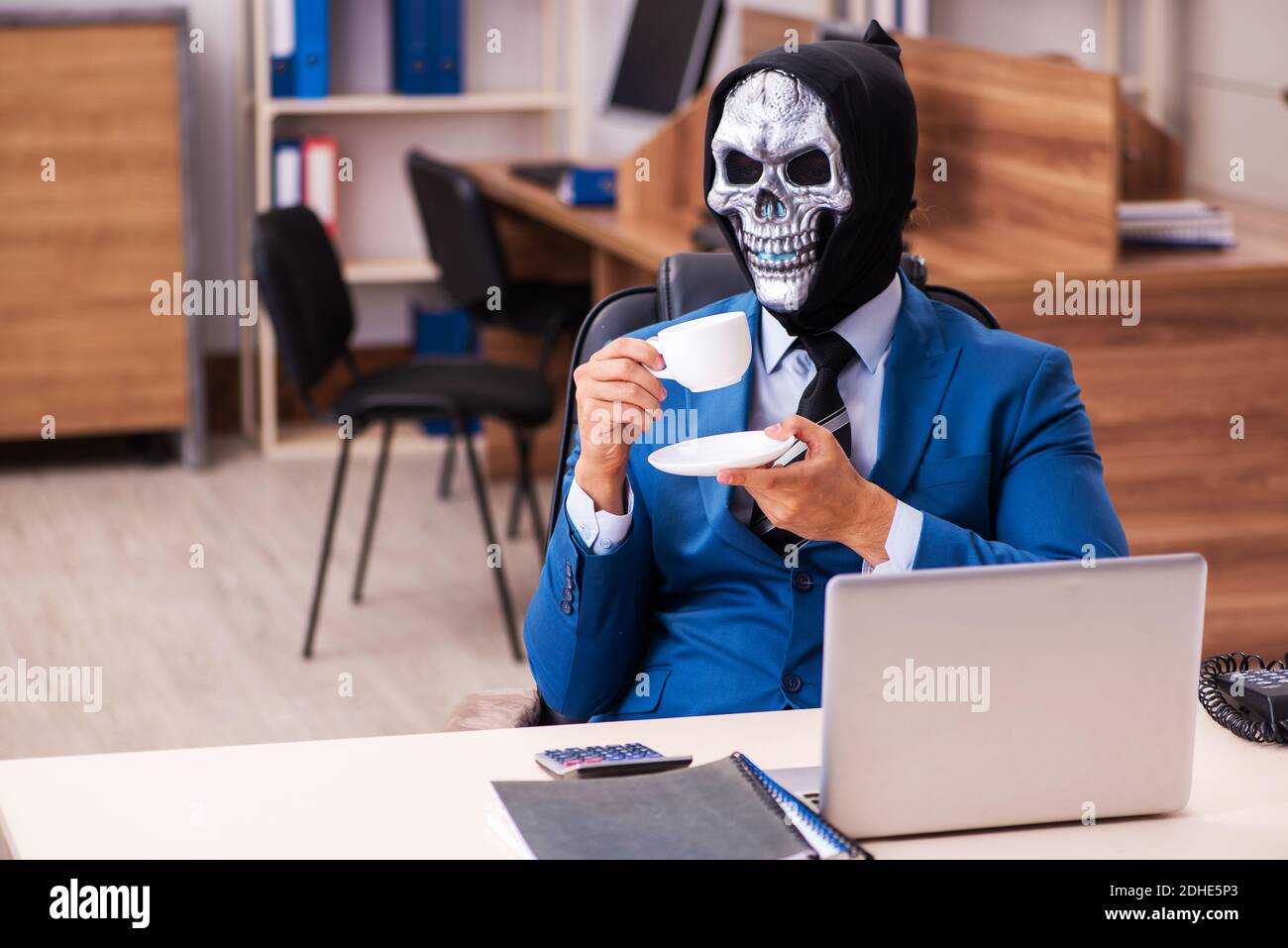 Devil businessman working in the office Stock Photo - Alamy