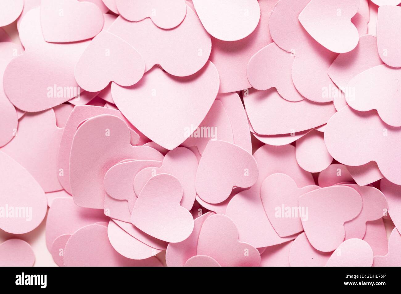 A top view shot of a heap of cute pink papers in a heart shape Stock ...