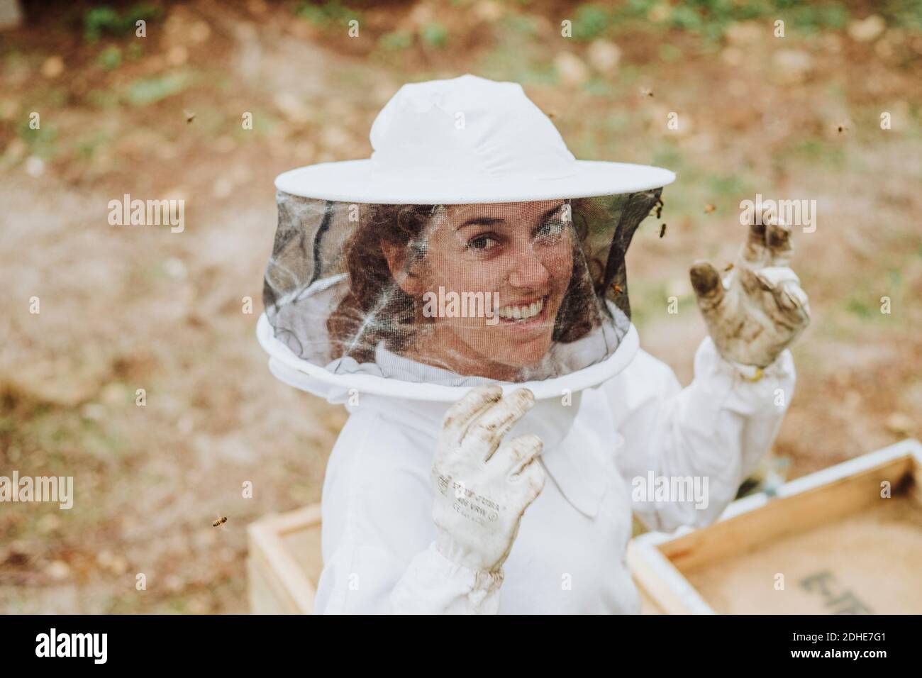 A portrait of a woman beekeeper Stock Photo - Alamy