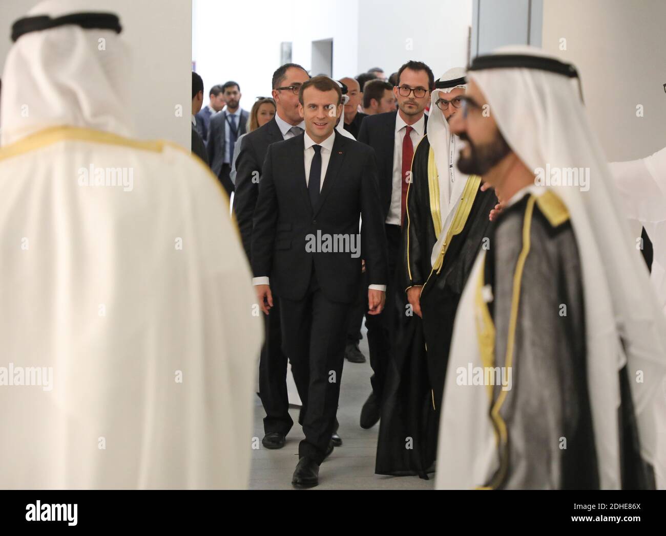 French President Emmanuel Macron (C) visits the Louvre Abu Dhabi Museum ...
