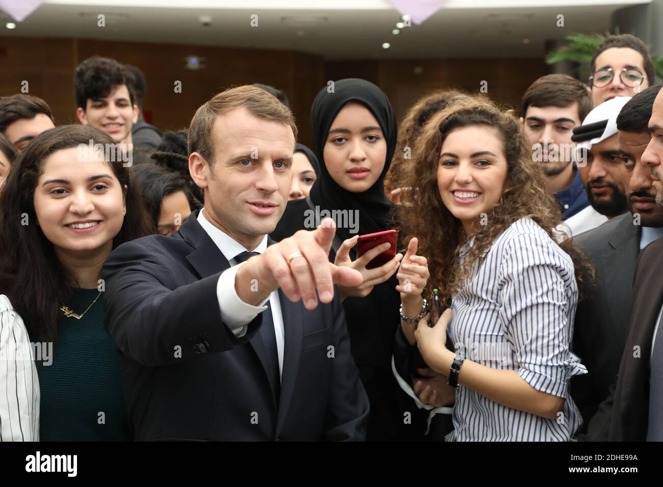 French President Emmanuel Macron poses for selfies with students during ...