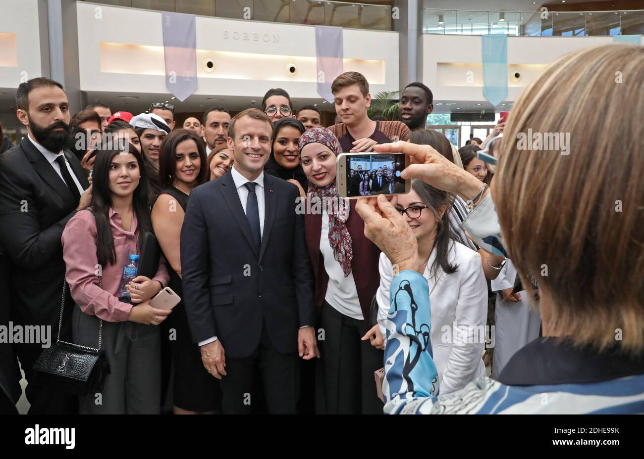 French President Emmanuel Macron poses for selfies with students during ...