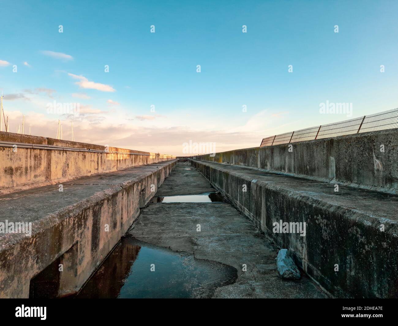 Pier concrete structure at the sunset Stock Photo - Alamy