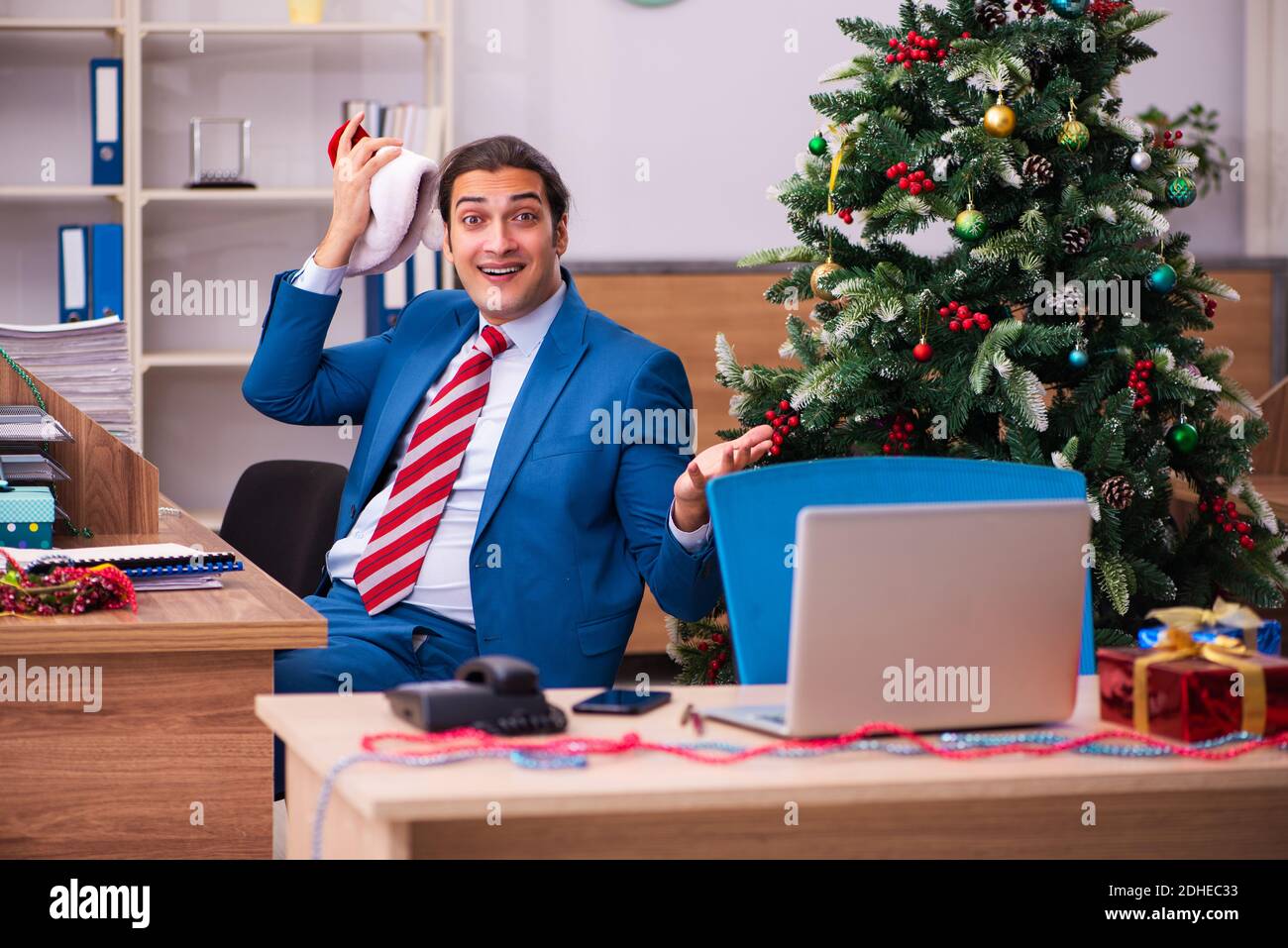Young male employee celebrating hi-res stock photography and images - Alamy