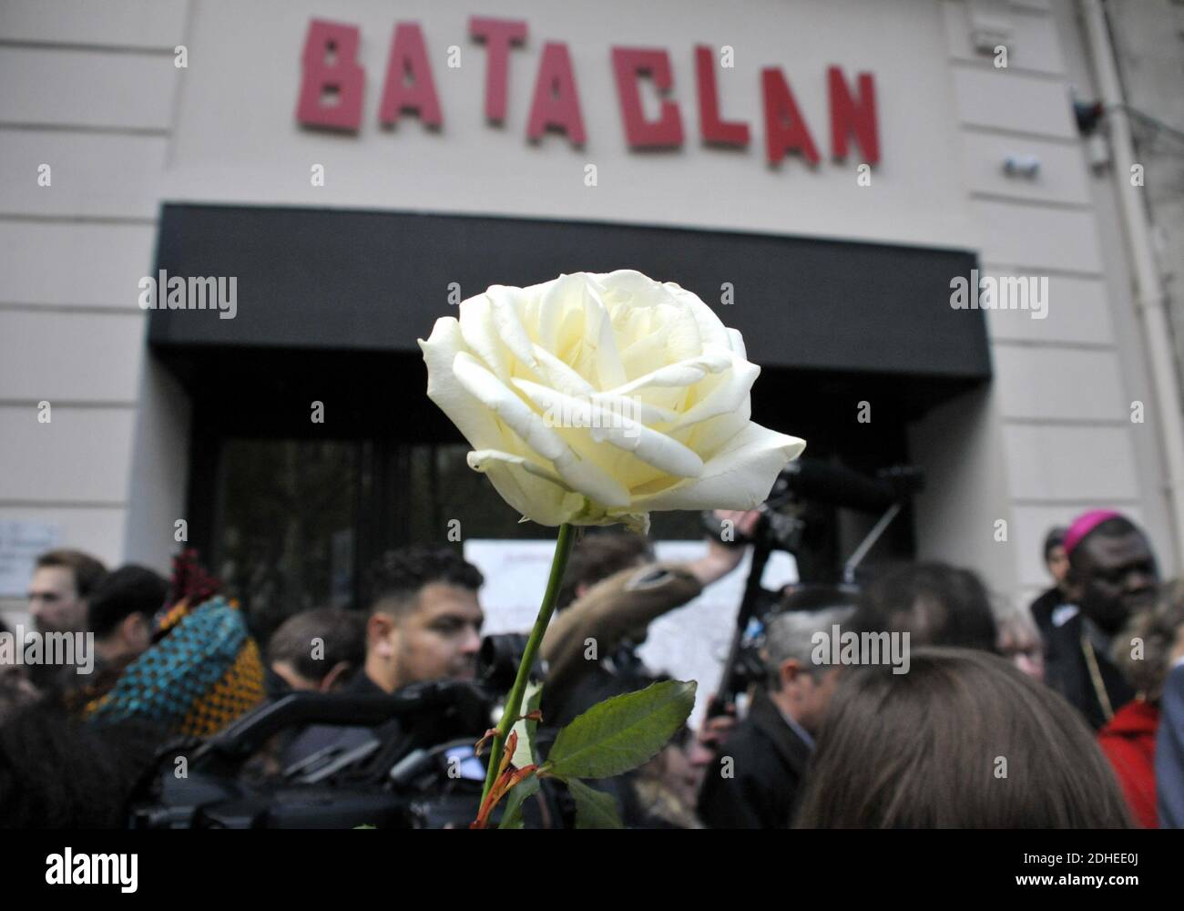People stand in front of the Bataclan concert venue during ceremonies ...
