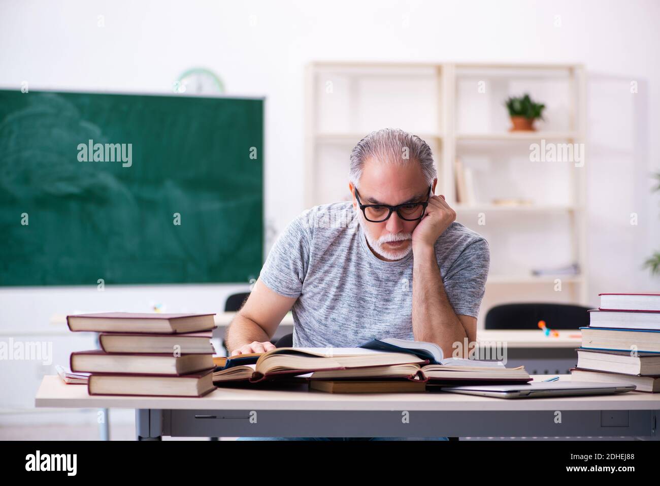 Old male student preparing for exams in the classroom Stock Photo - Alamy