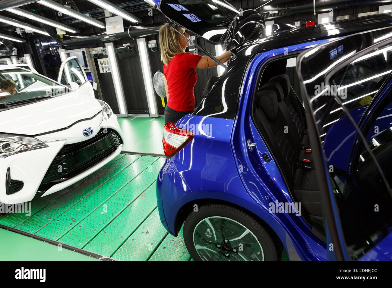Toyota workers assemble Yaris and Yaris Hybrid cars on the company's ...