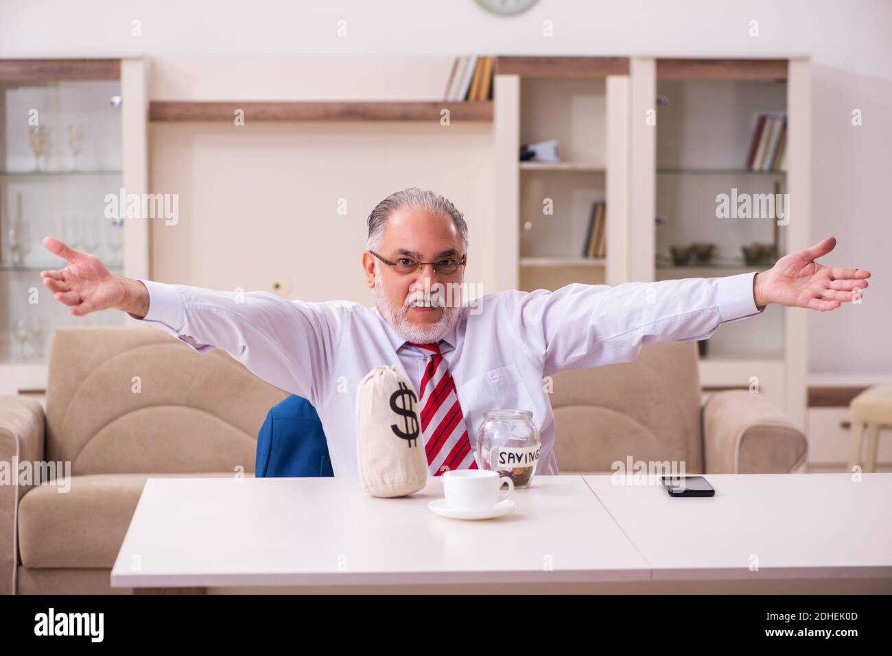 Old male boss employee in retirement concept Stock Photo - Alamy