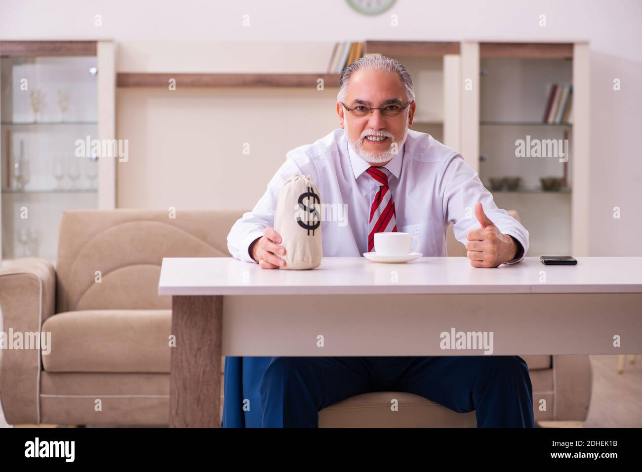 Old male boss employee in retirement concept Stock Photo - Alamy