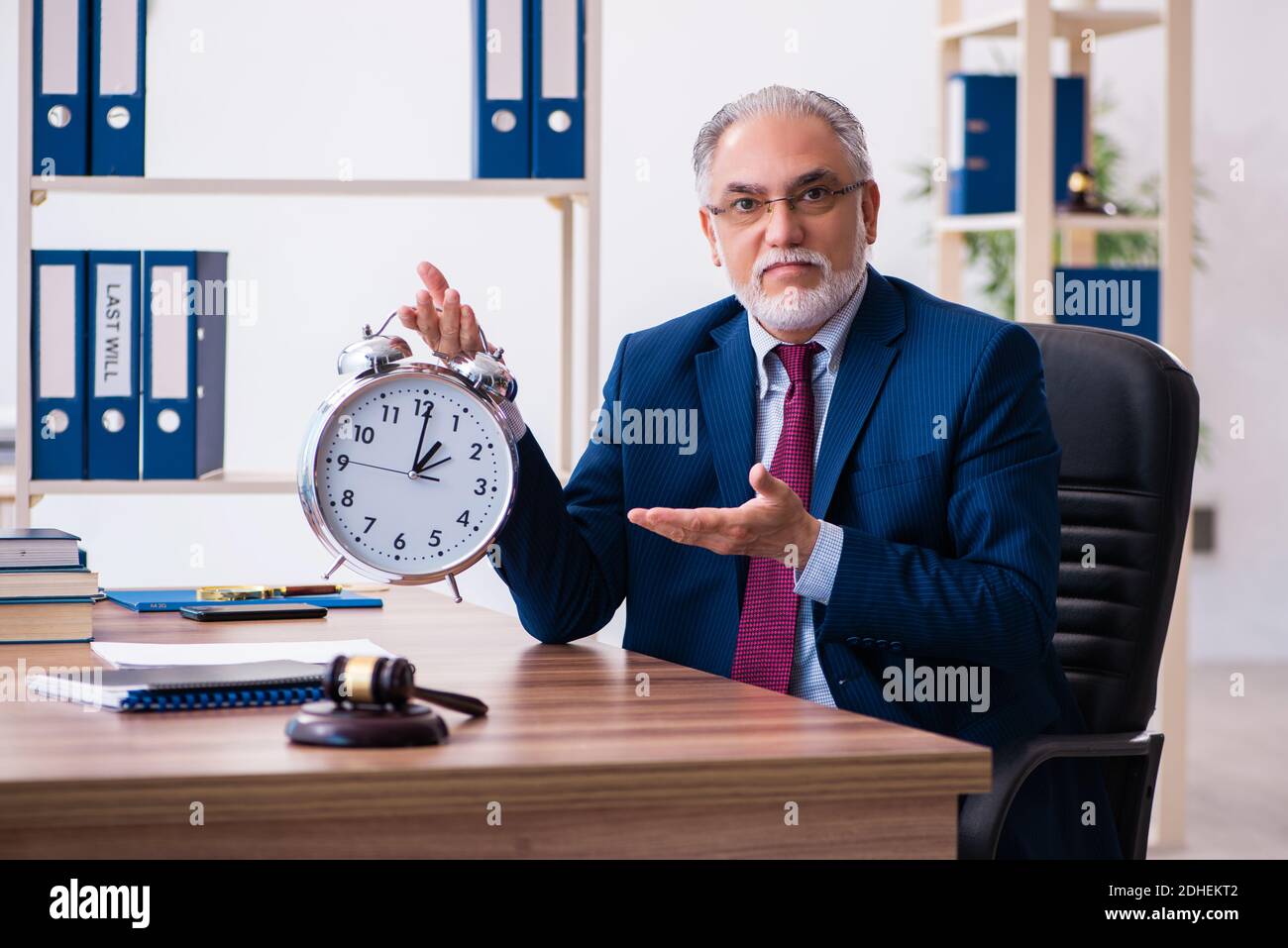 Experienced male judge sitting in the office Stock Photo - Alamy