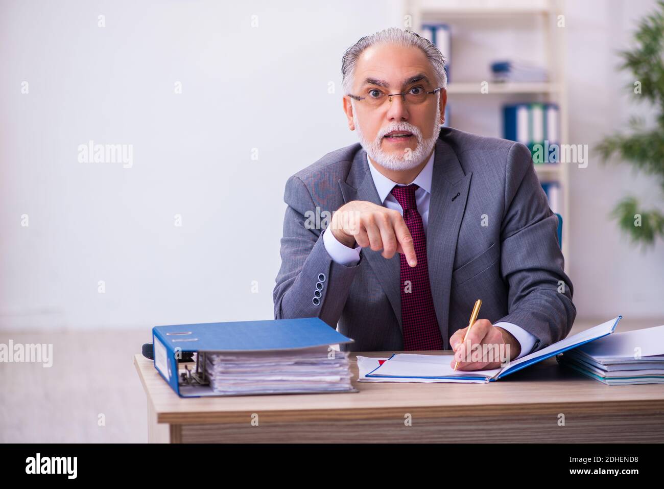 Hardworking employee writing in documents hi-res stock photography and ...