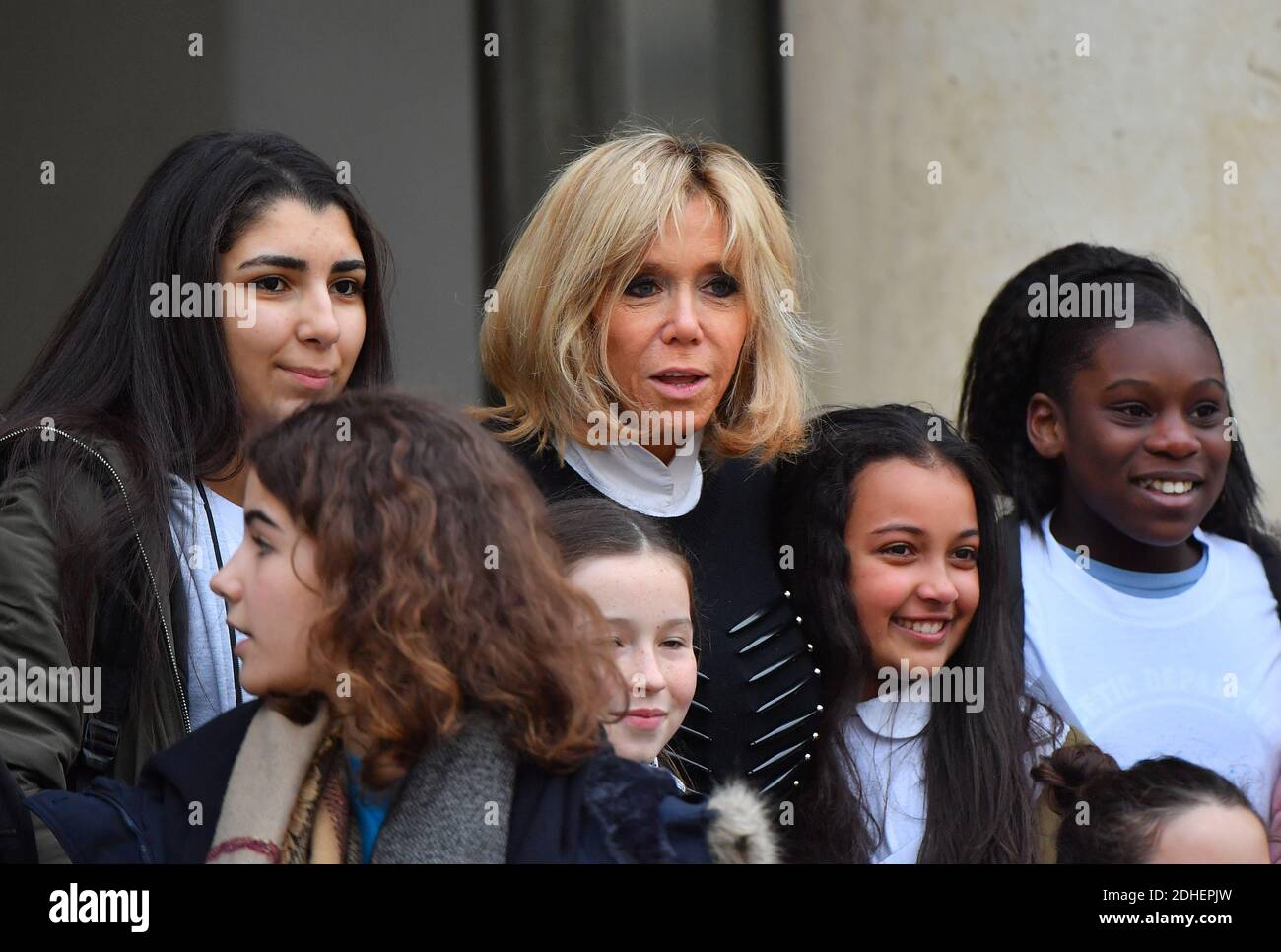 Brigitte Macron, the wife of the French president, welcomes a group of ...
