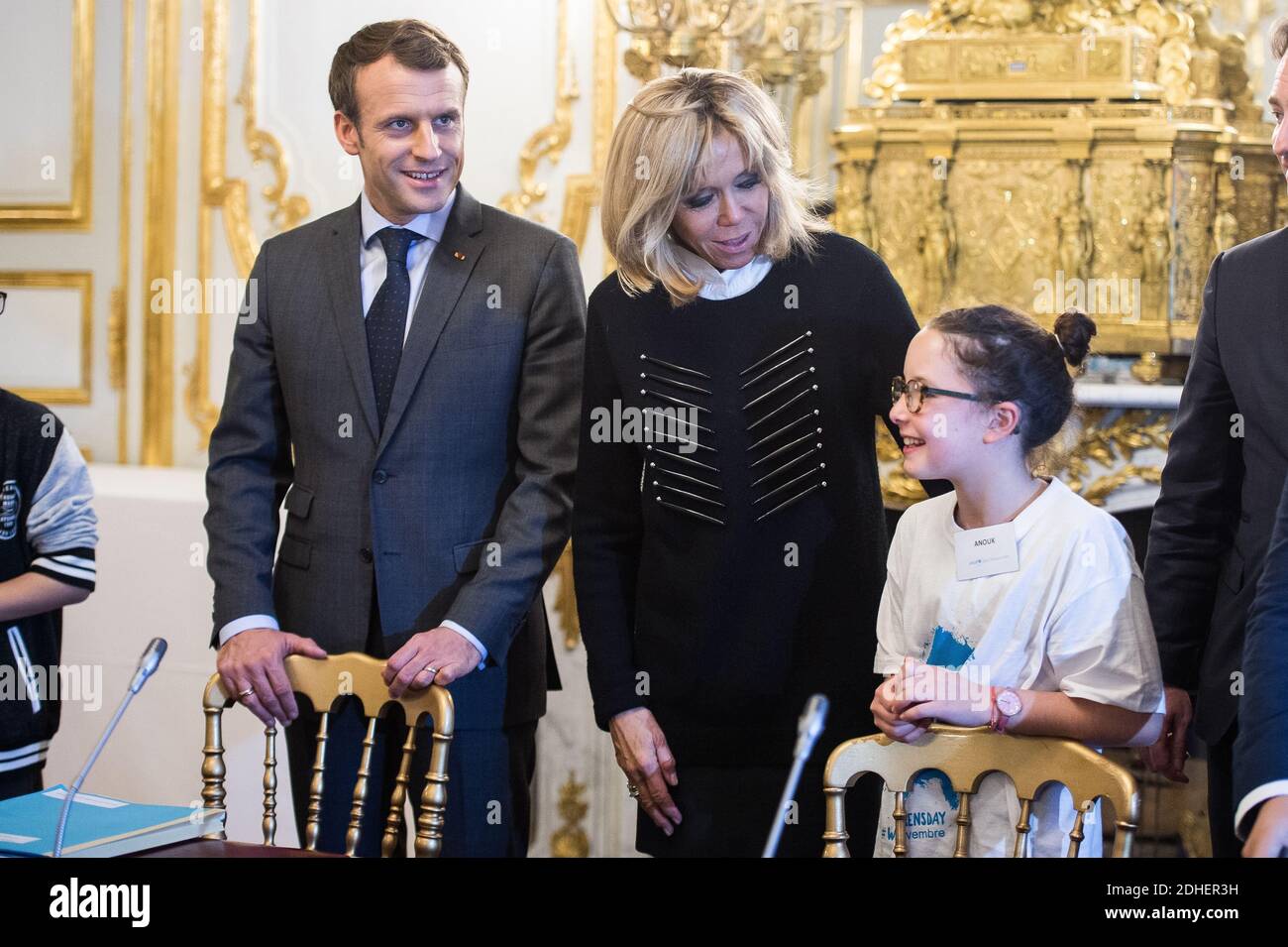 French President Emmanuel Macron and his wife Brigitte receive children ...