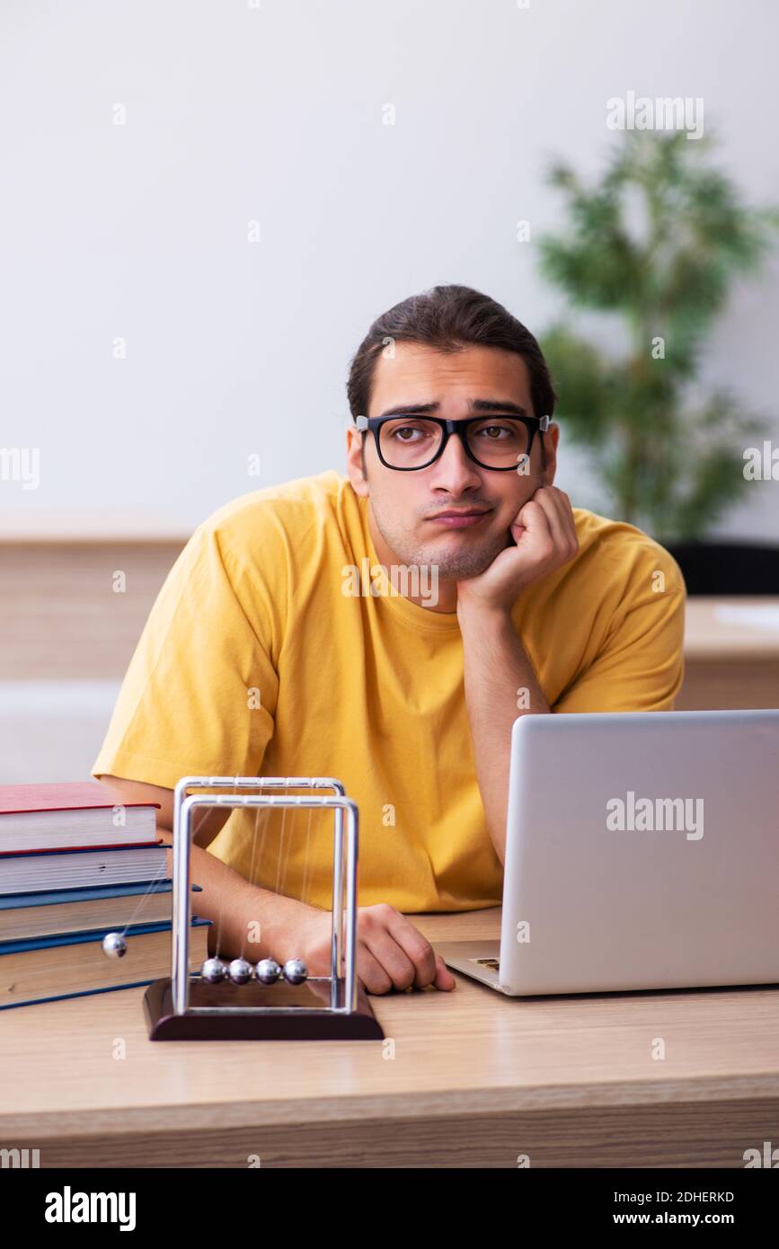 Young male student physics preparing for exams in the classroom Stock ...