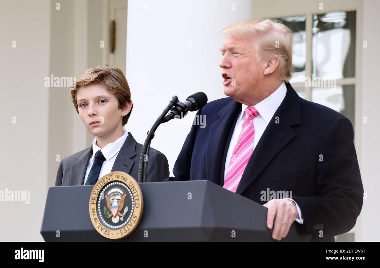 U.S President Donald Trump speaks as son Barron Trump looks on during a ...
