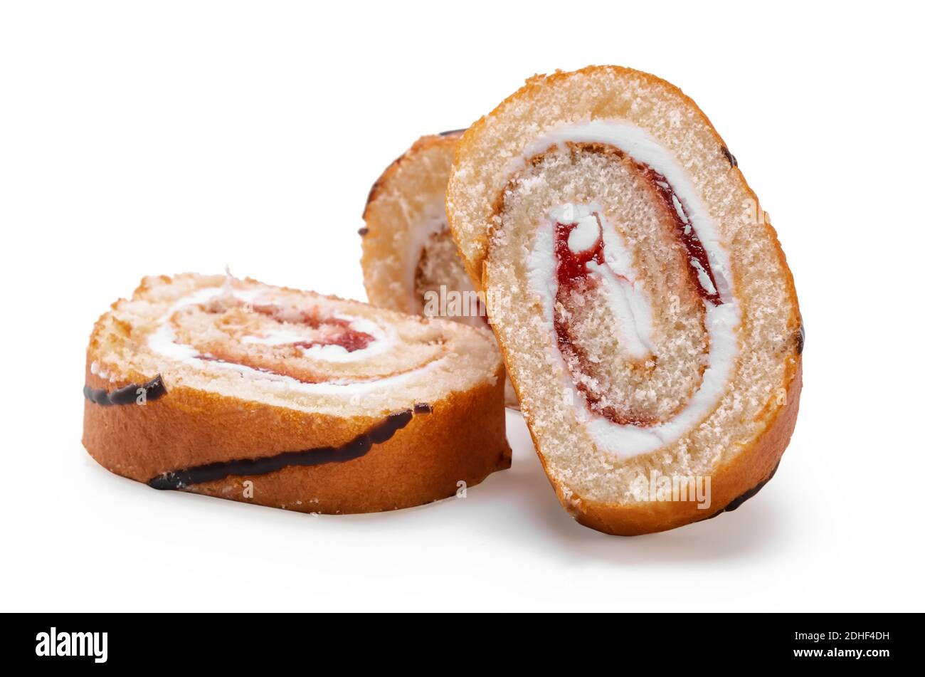 Sliced cake roll on white background Stock Photo - Alamy