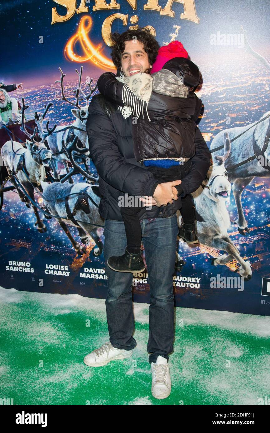 Max Boublil and his daughter arriving at 'Santa & Cie' Paris film ...