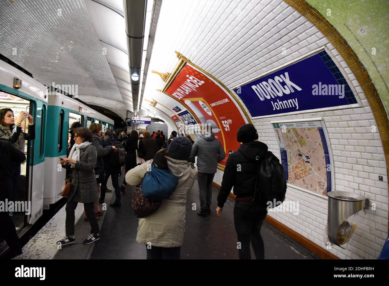 Commuters pass by the Duroc metro station which was renamed Durock ...