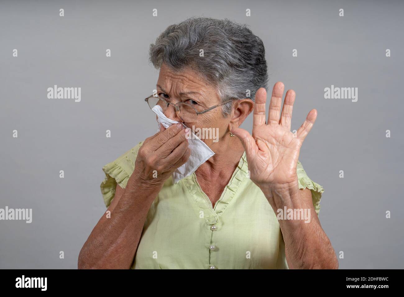 Sick old woman with cold Stock Photo - Alamy