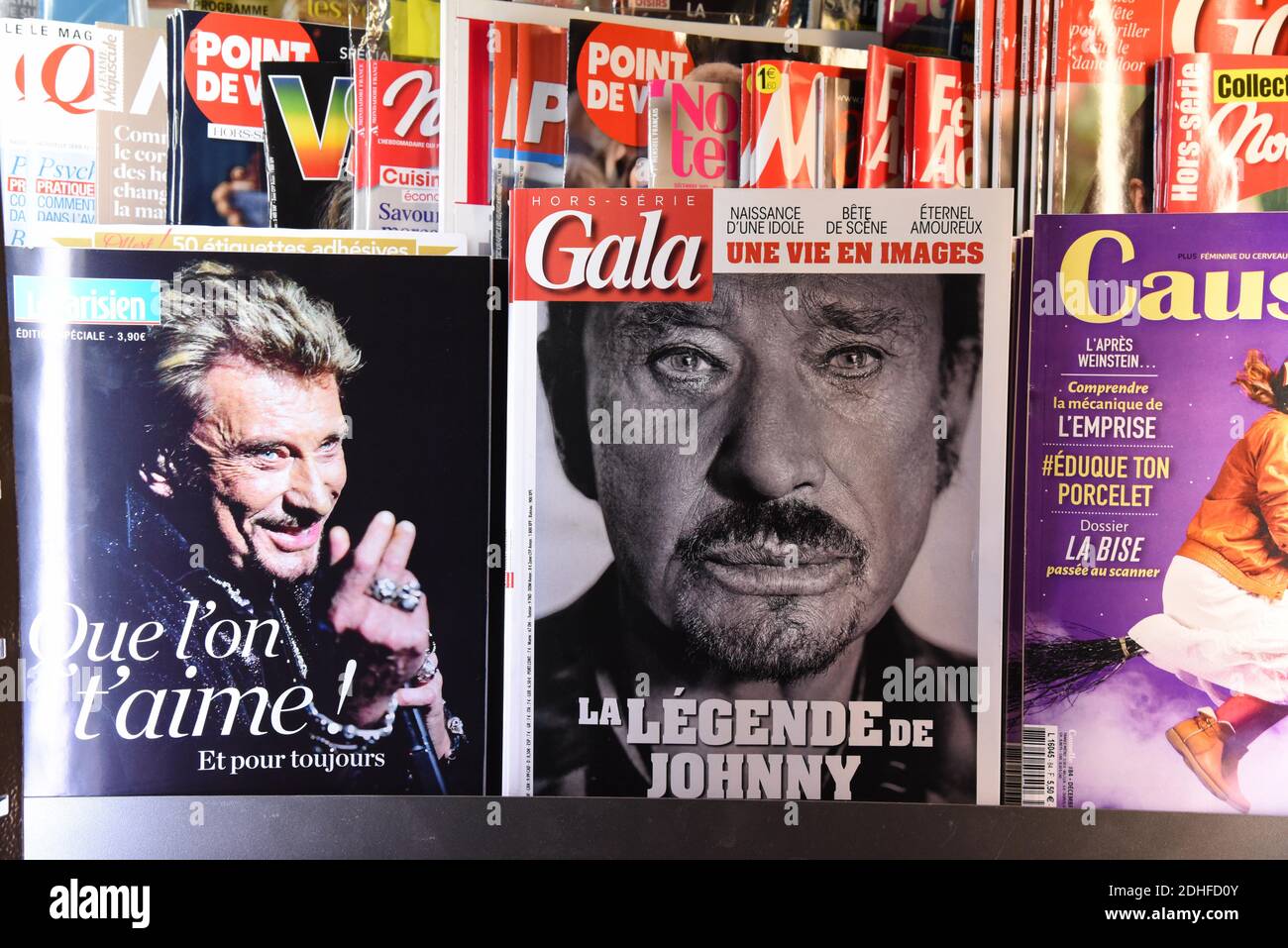 Magazines featuring Johnny Hallyday on their cover are on display in a ...
