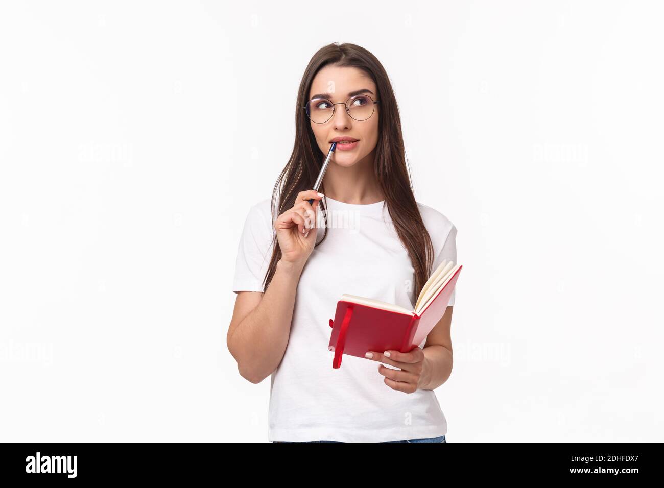 Young woman biting pen High Resolution Stock Photography and Images - Alamy