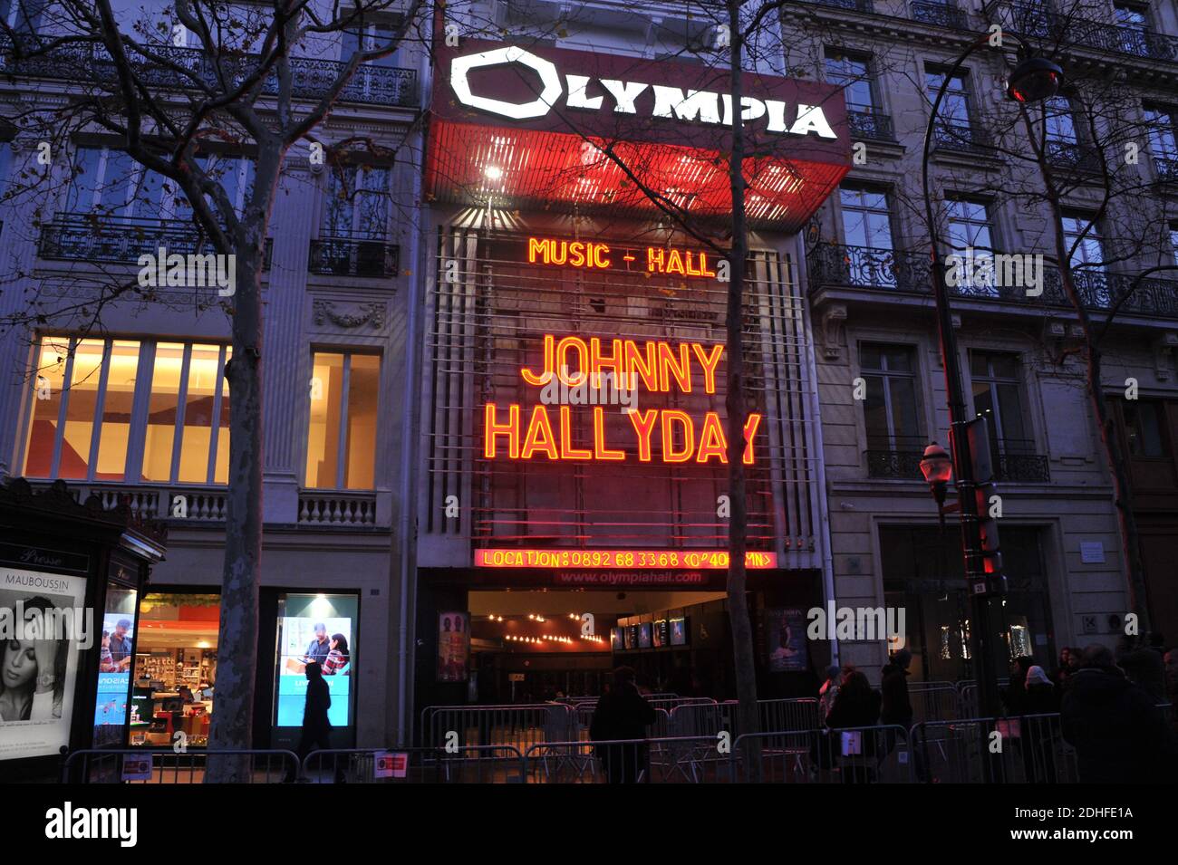 The Olympia Concert Hall is lit up with the name of Johnny Hallyday in ...