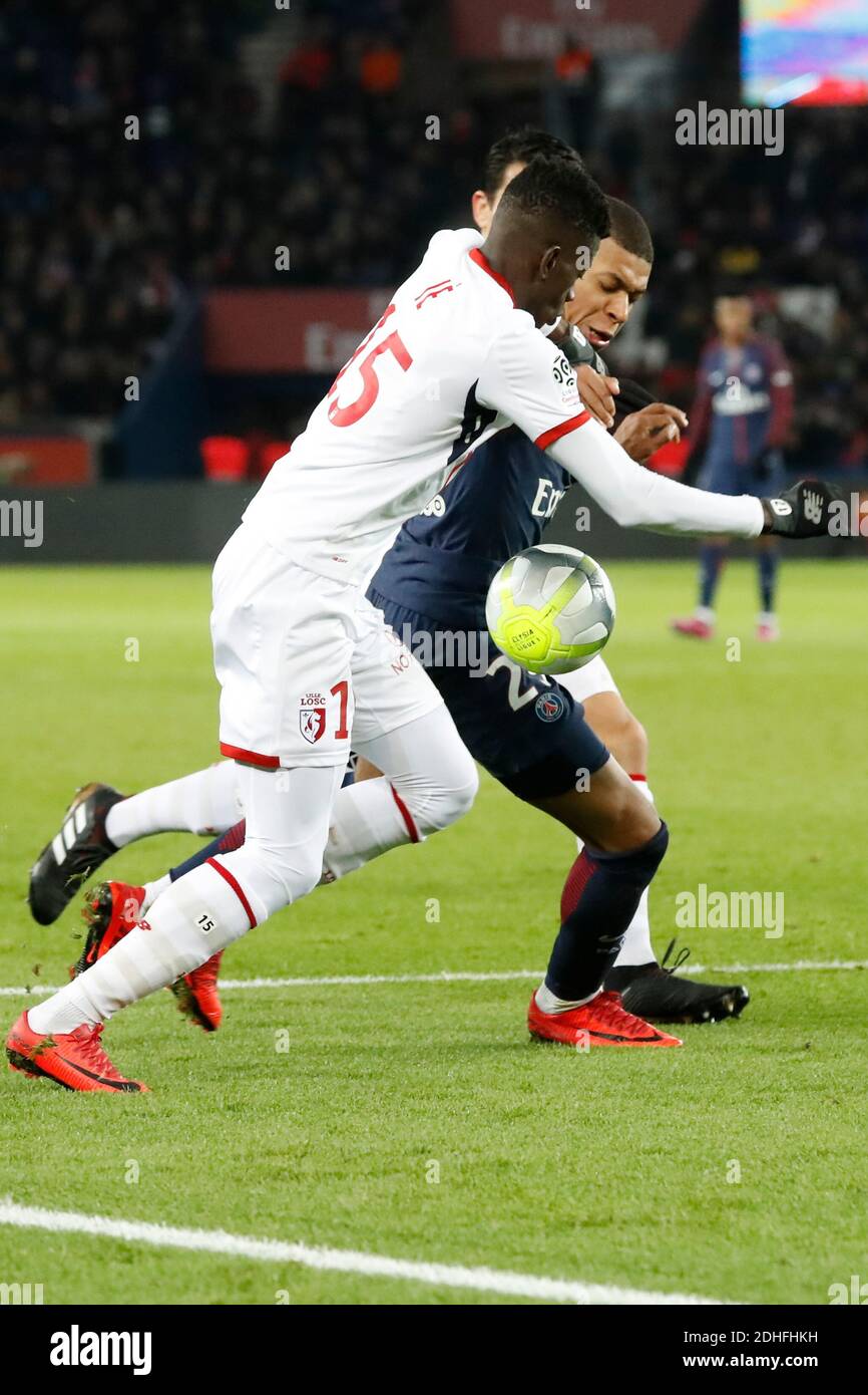 PSG's Kylian Mbappe battling Lille's Edgar Ie during the French Ligue 1 ...