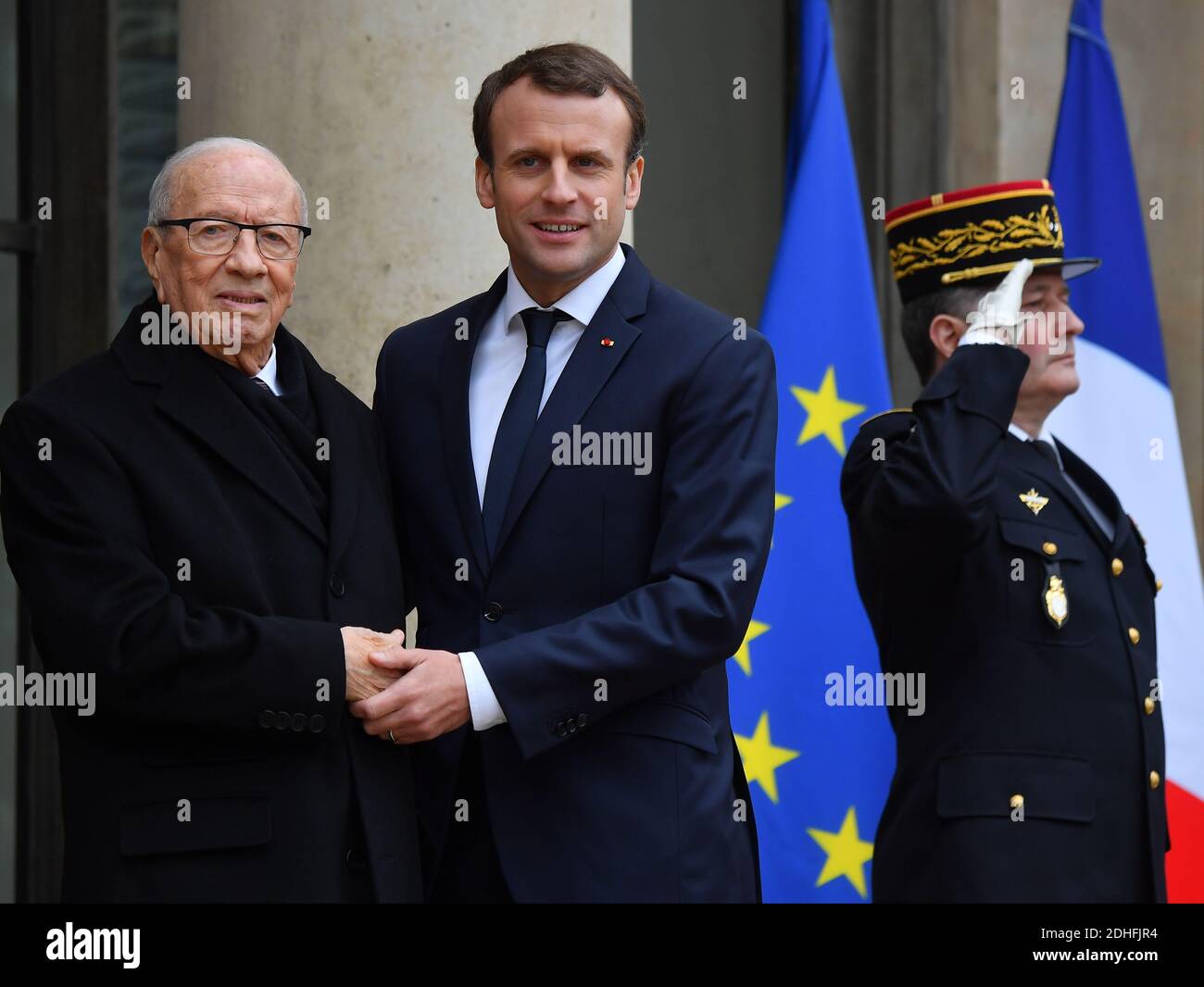 French President Emmanuel Macron greets Tunisian President Beji Caïd ...
