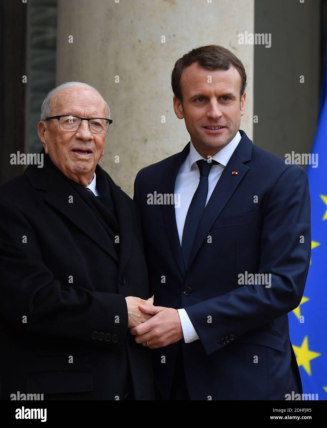 French President Emmanuel Macron greets Tunisian President Beji Caïd ...