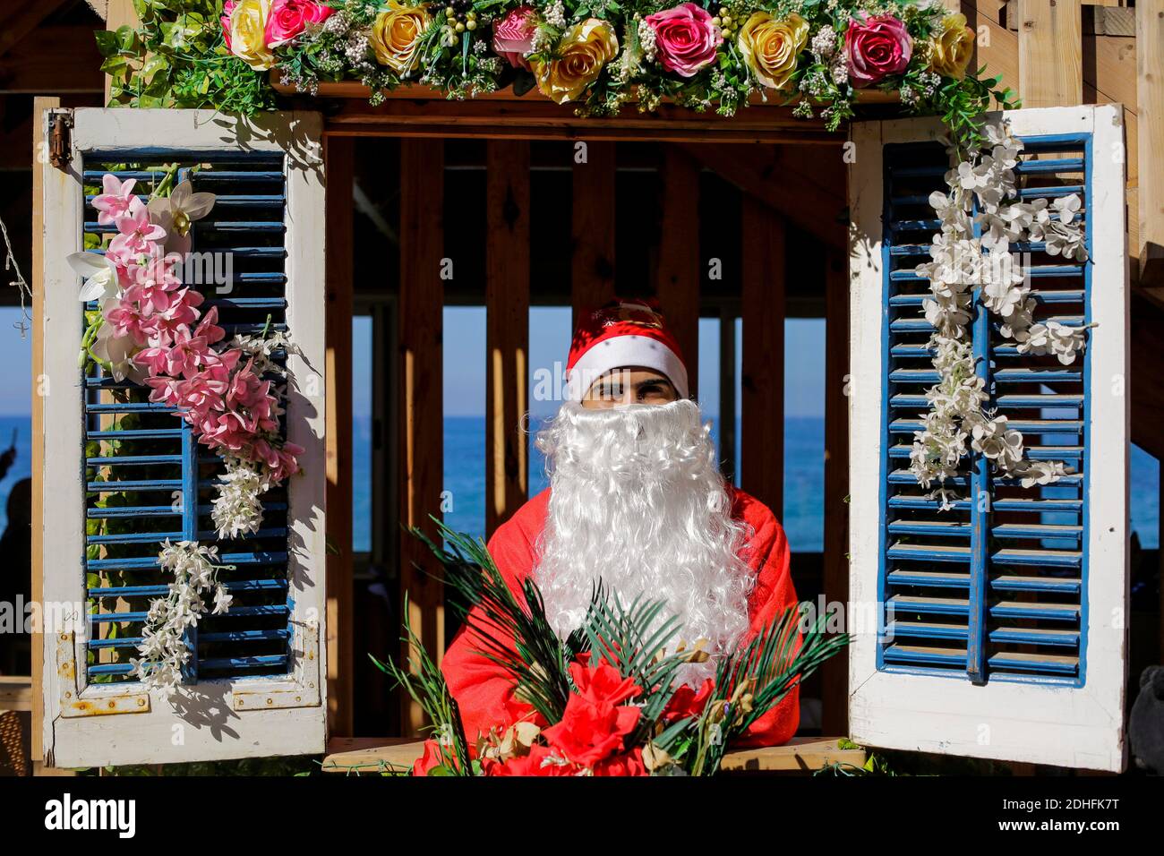 Gaza, Palestine. 10th Dec, 2020. A Palestinian waiter dressed as a ...