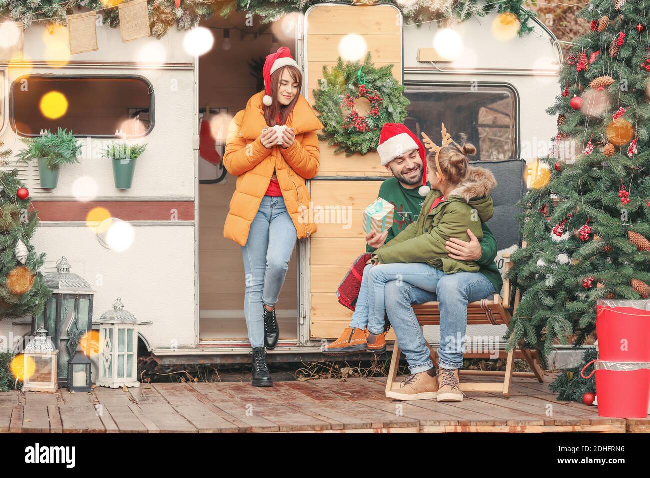 Happy family celebrating Christmas outdoors Stock Photo - Alamy