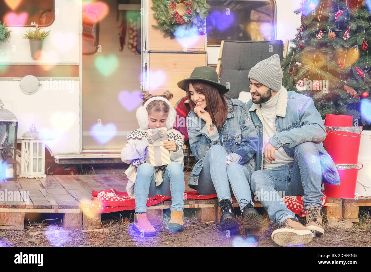 Happy family celebrating Christmas outdoors Stock Photo - Alamy