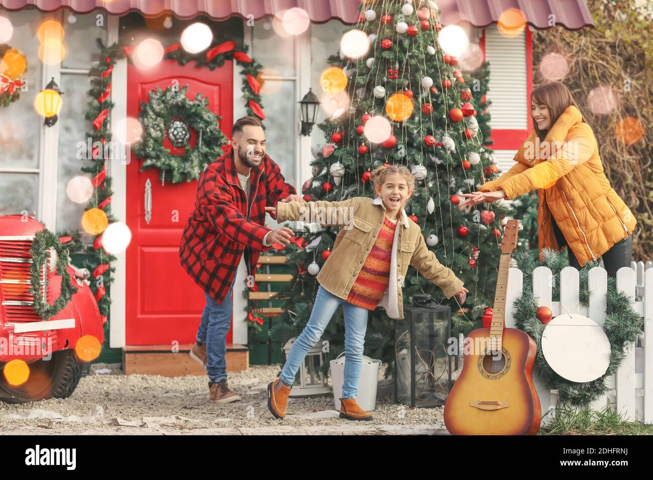 Happy family celebrating Christmas outdoors Stock Photo - Alamy