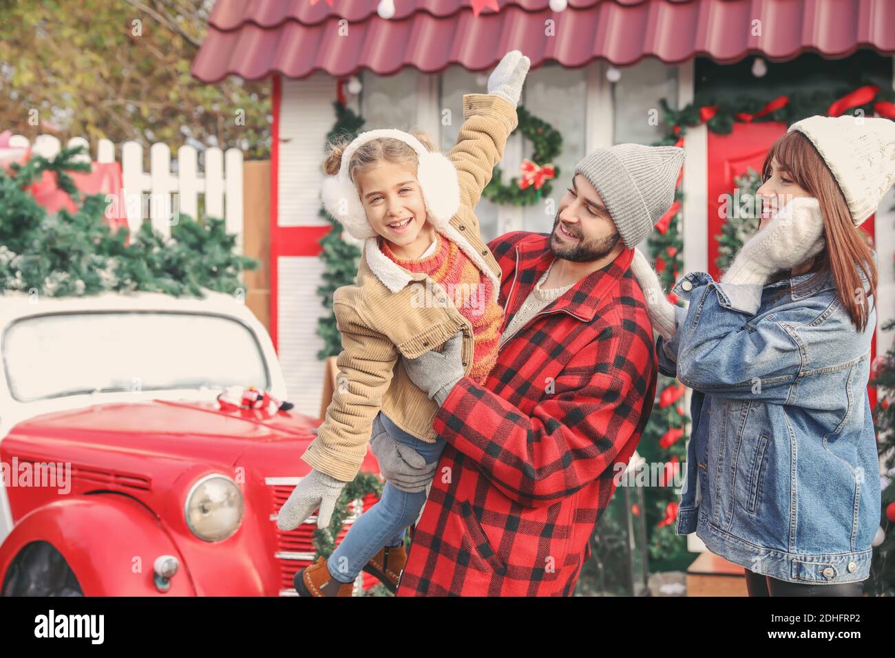 Happy family celebrating Christmas outdoors Stock Photo - Alamy