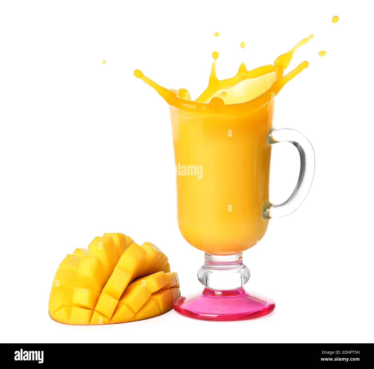 Glass cup of fresh splashing mango juice on white background Stock ...