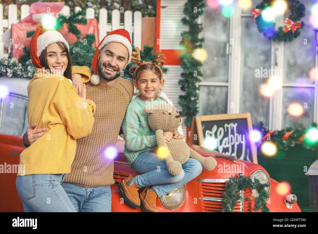 Happy family celebrating Christmas outdoors Stock Photo - Alamy