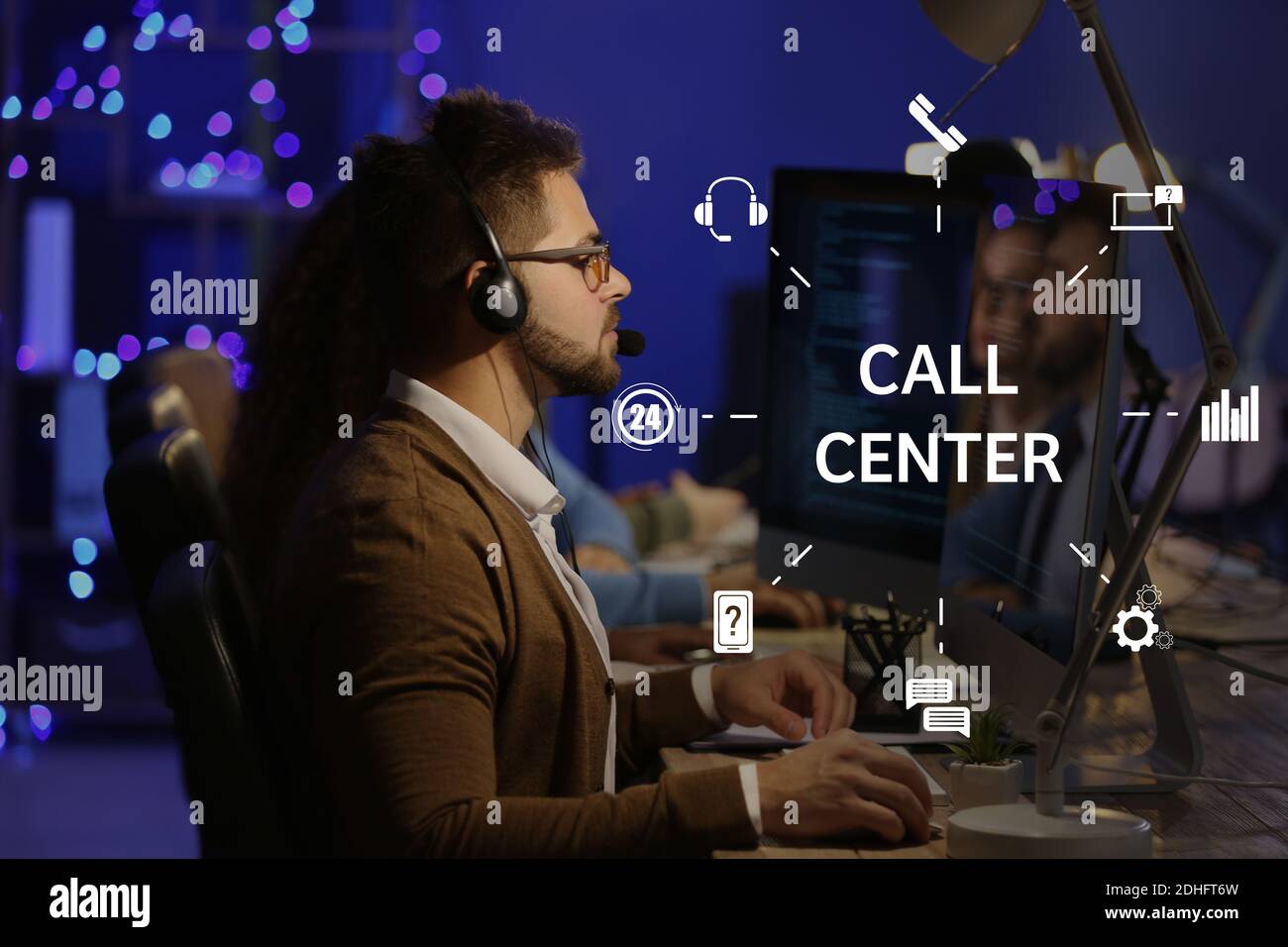Technical support agents working in office at night Stock Photo - Alamy