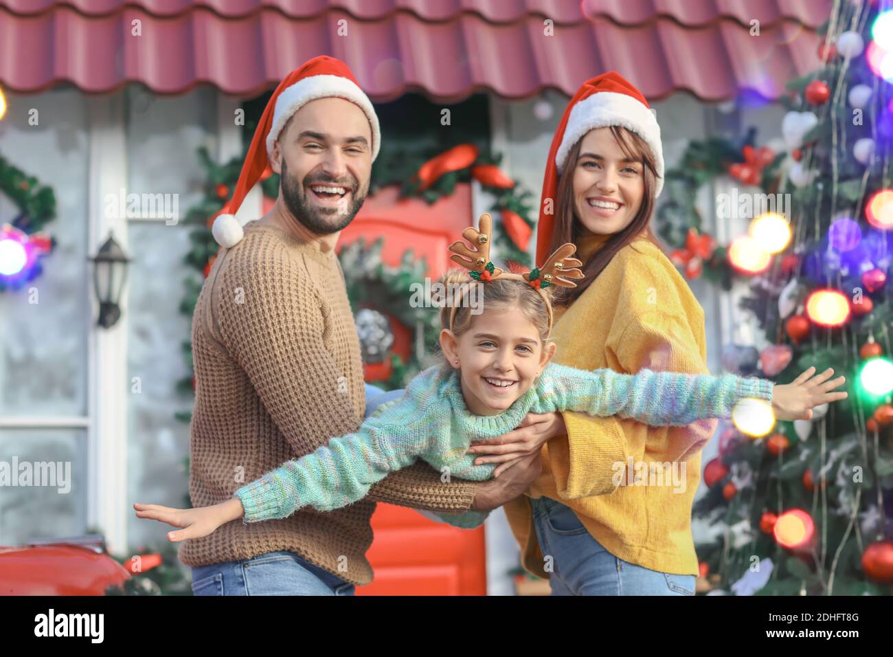 Happy family celebrating Christmas outdoors Stock Photo - Alamy