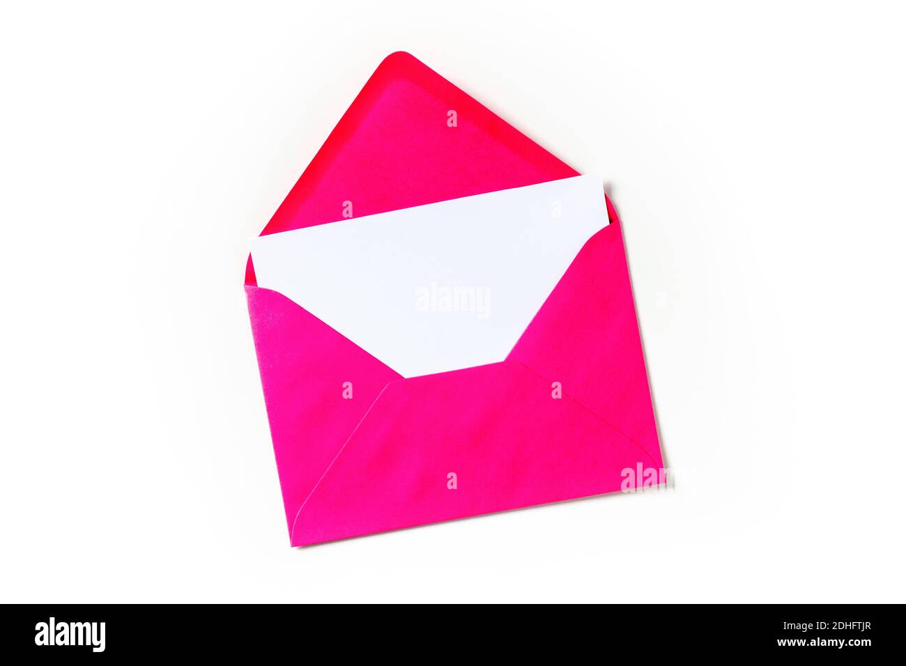 A greeting card in a pink envelope mockup, shot from above on a white ...