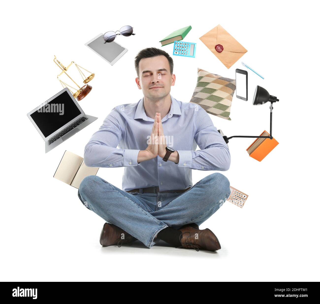 Different things flying around handsome meditating man on white ...