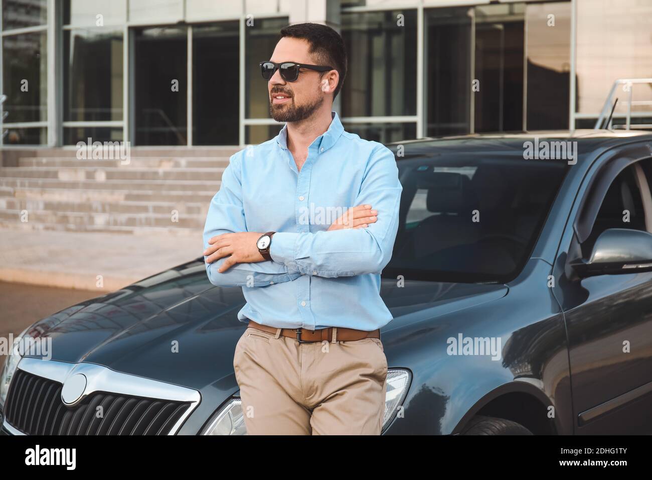 Handsome man near modern car Stock Photo - Alamy