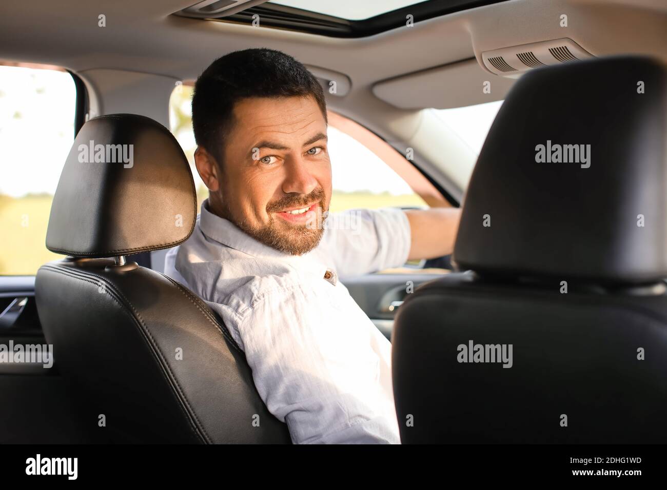 Happy man beard driving car hi-res stock photography and images - Alamy