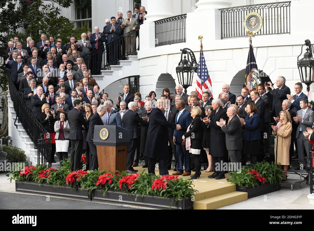 President Donald Trump celebrates the tax bill passage with members of ...