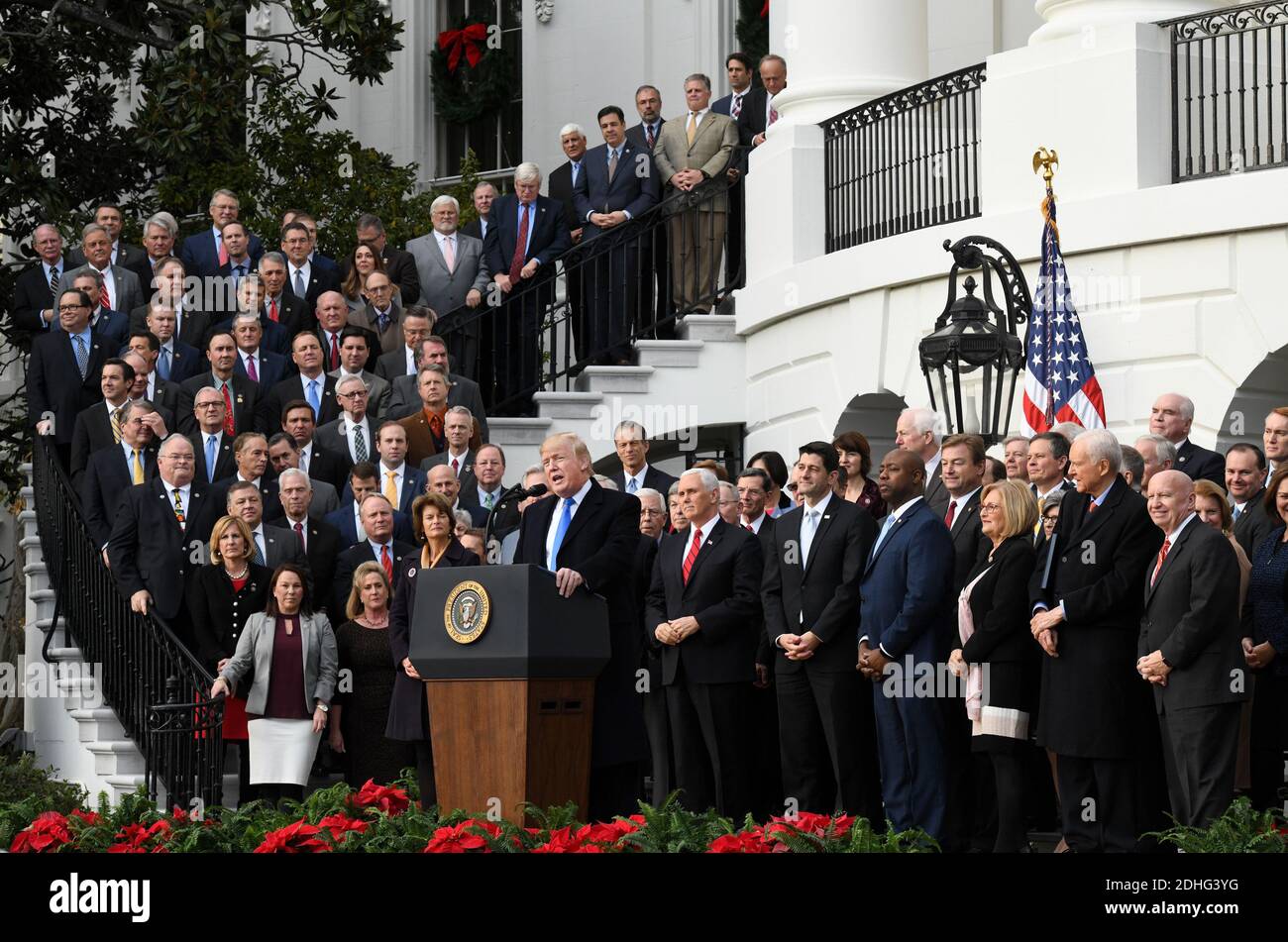 President Donald Trump celebrates the tax bill passage with members of ...